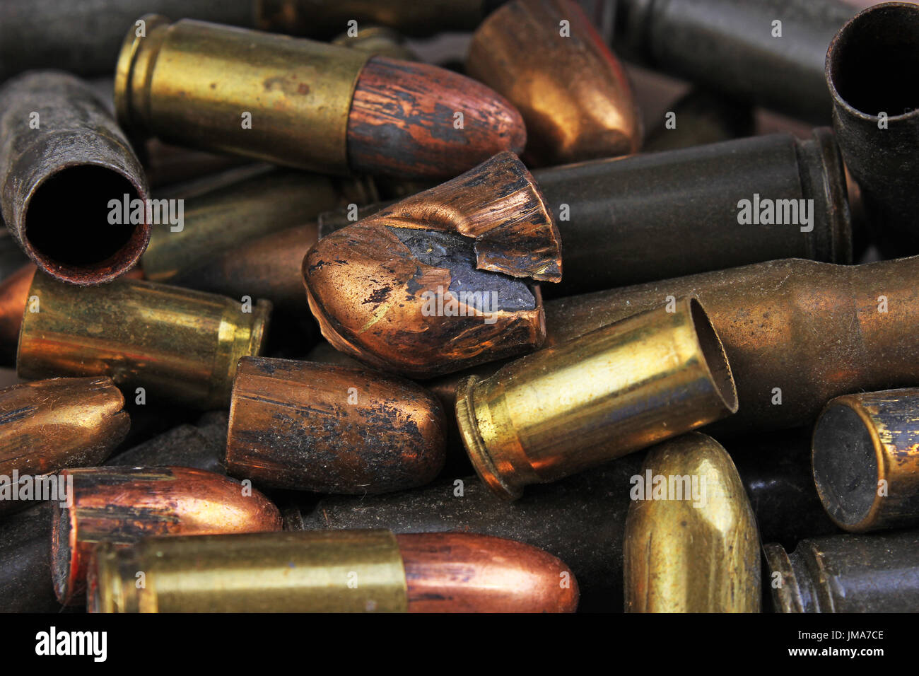 Heap of gun bullets. Weapon Cartridge case sleeve background texture, 7 ...