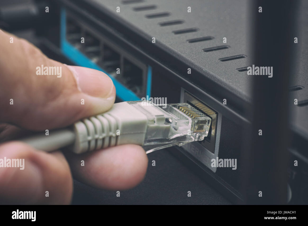 Plugging in cable hi-res stock photography and images - Alamy