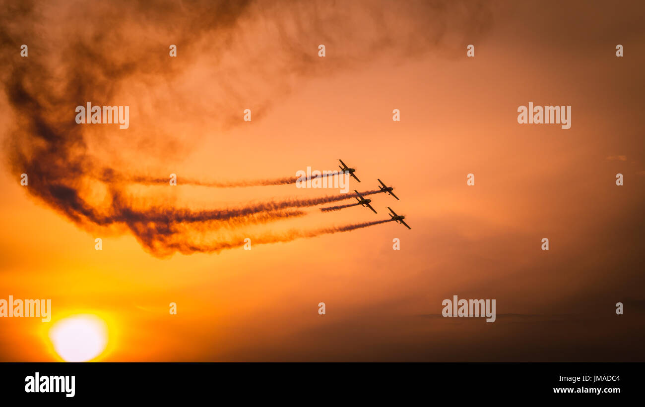 Airplanes on airshow. Aerobatic team performs flight at air show ...