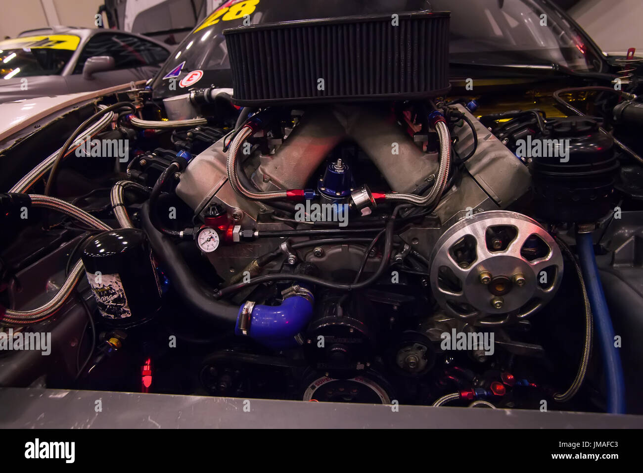 Racing equipment under car hood Stock Photo - Alamy