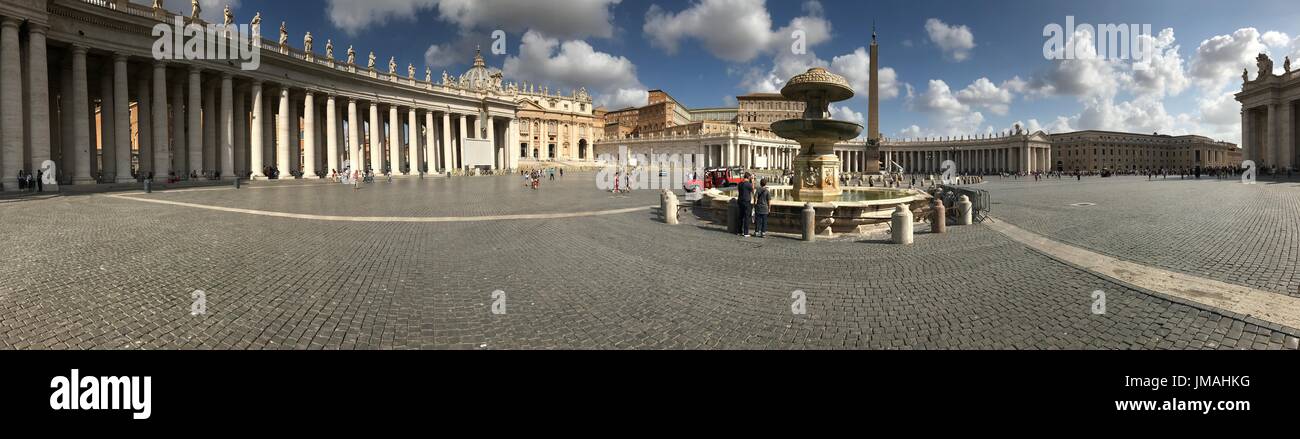 Vatican, a panoramic view of the still water fountain near tall ...