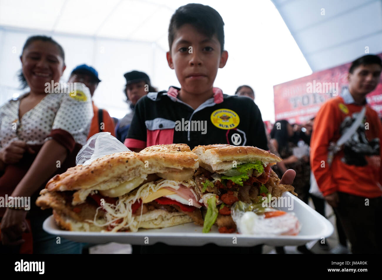 Mexico City, Mexico. 26th July, 2017. A boy shows a Mexican traditional ...