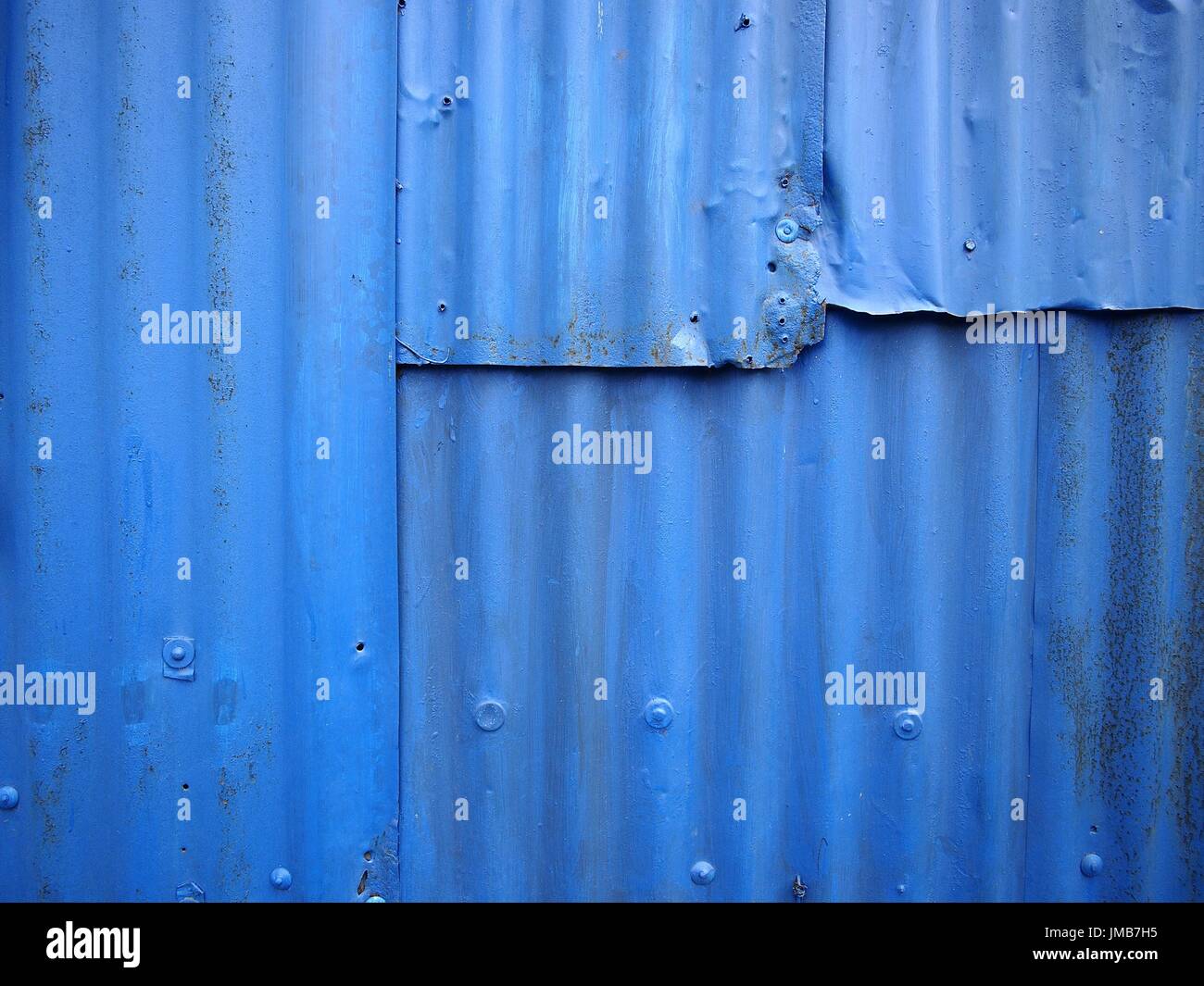 Photo of galvanized iron sheets painted blue Stock Photo - Alamy
