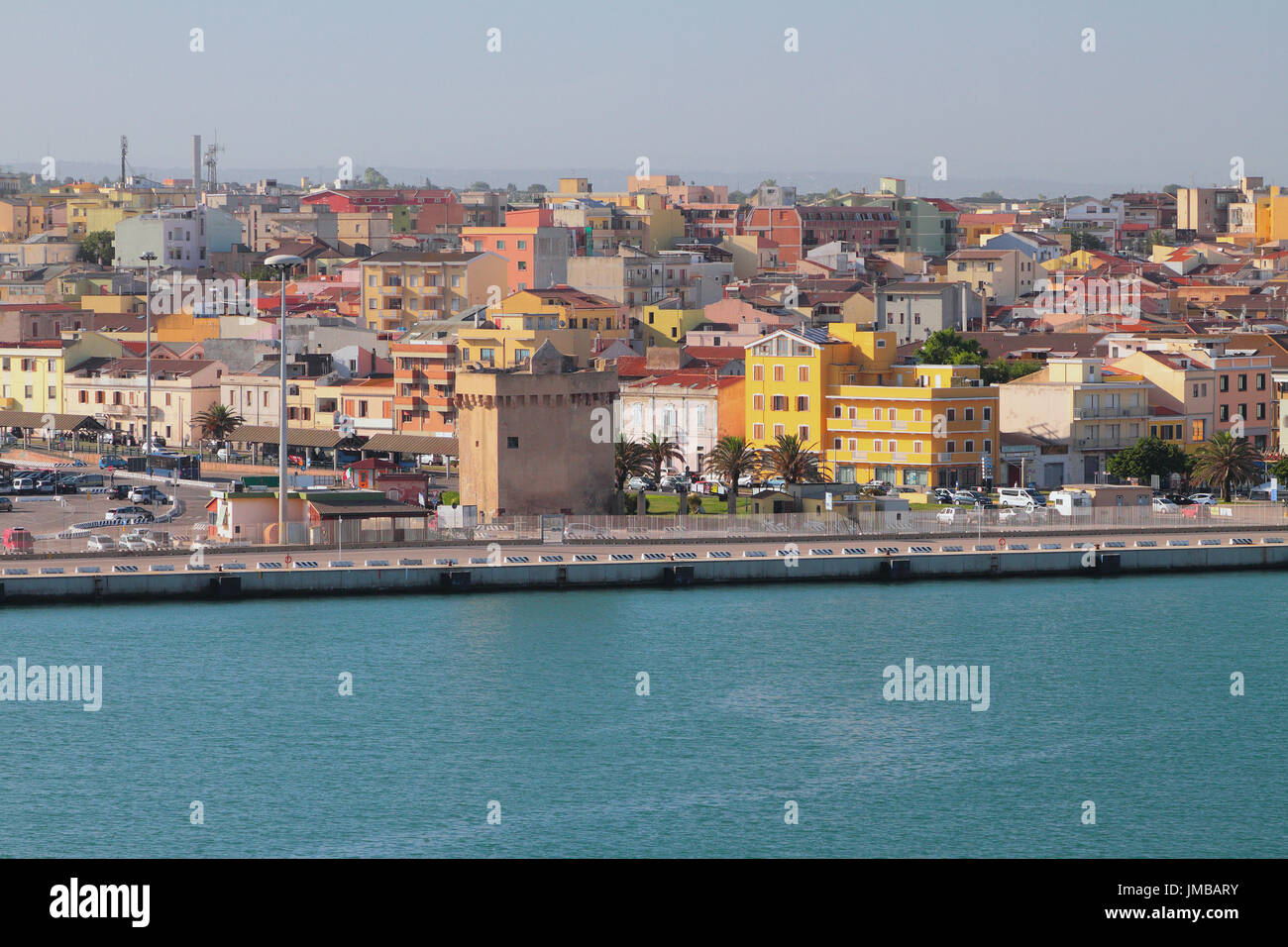 Embankment, ancient tower and city. Porto-Torres, Italy Stock Photo - Alamy