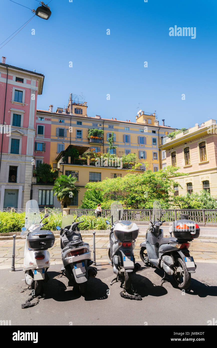 Milan, Italy vibrant and colourful summer background with vespas on the ...
