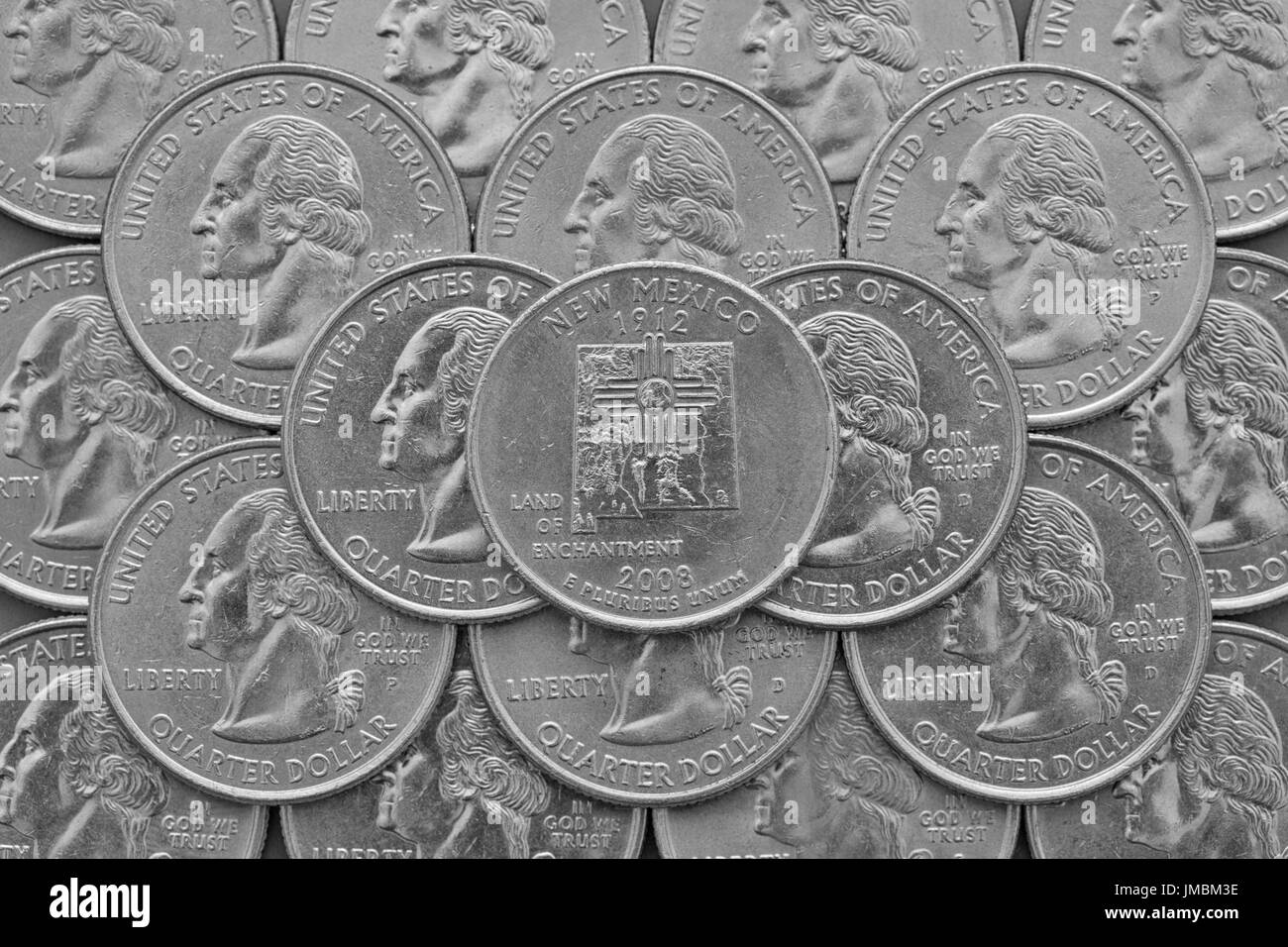 New Mexico State and coins of USA. Pile of the US quarter coins with ...