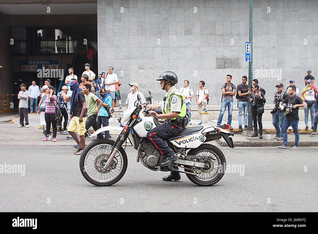 A police officer on his motorcycle in Caracas during a protest Stock ...
