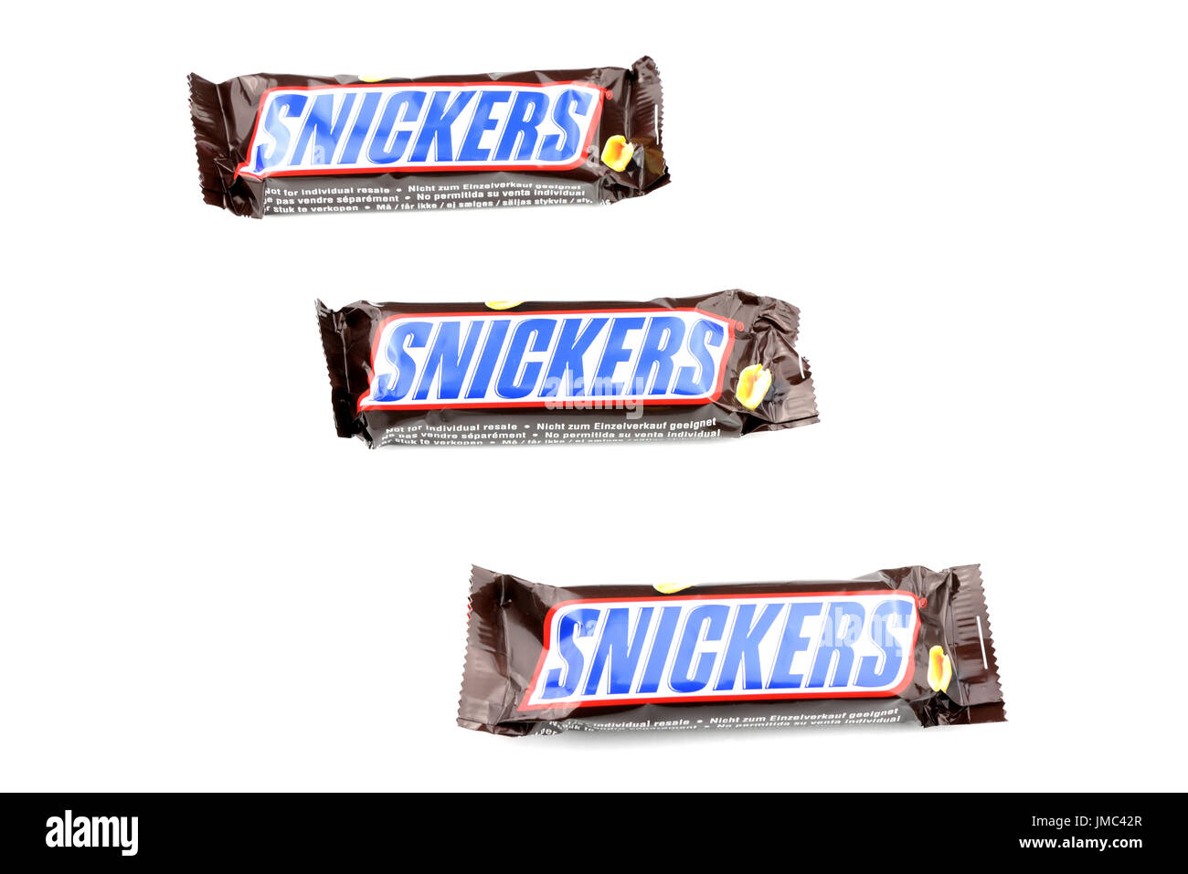 Three Snickers chocolate bars isolated on white background Stock Photo ...