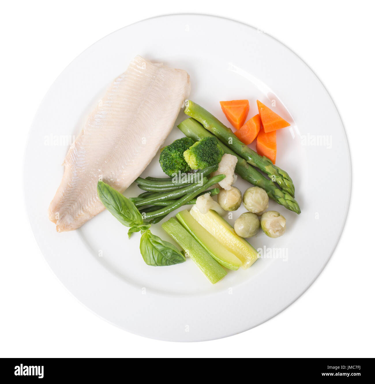 Steamed trout fillet with vegetables. Isolated on a white background ...