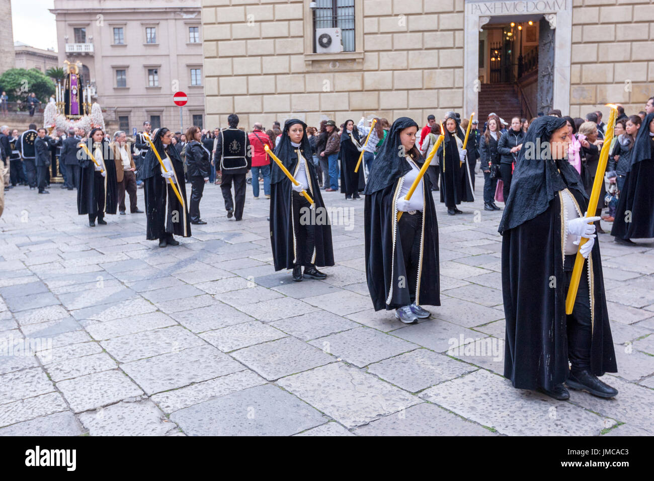 Women in black with candles during Good Friday procession, Easter ...
