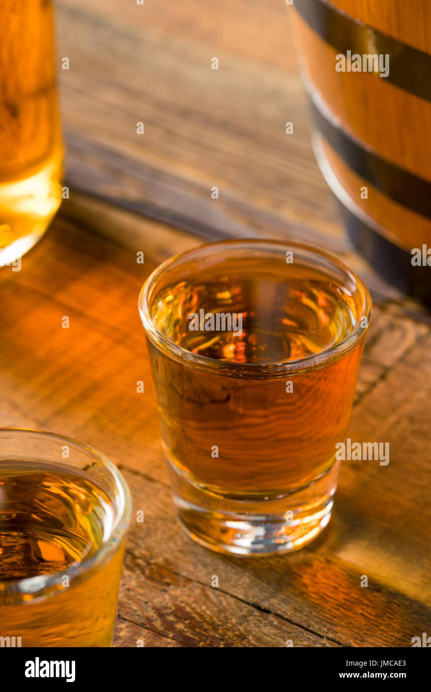 Alcoholic Brown Rum in a Shot Glass Ready to Drink Stock Photo - Alamy