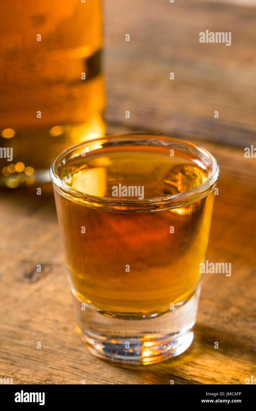 Alcoholic Brown Rum in a Shot Glass Ready to Drink Stock Photo - Alamy