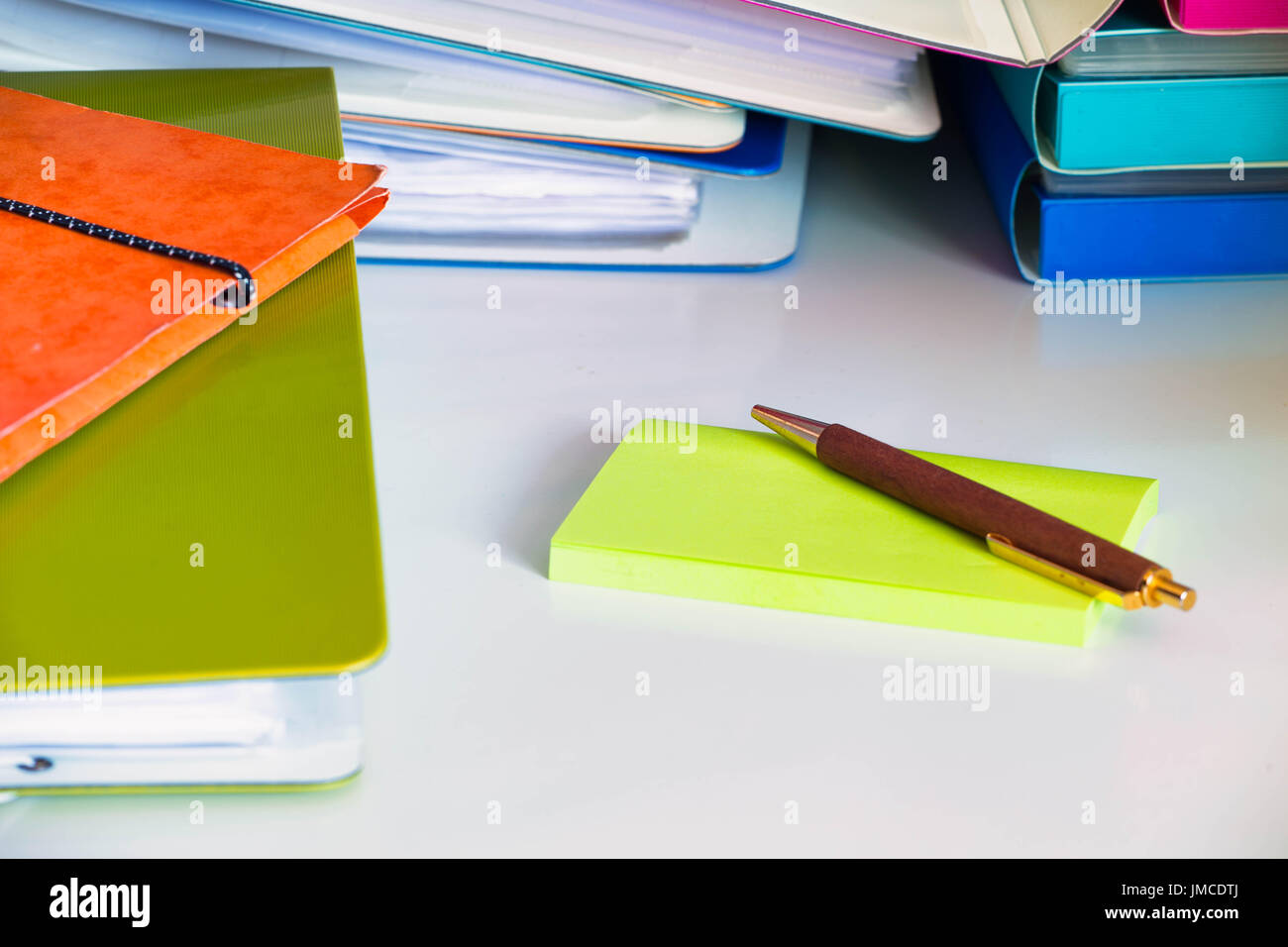 Stacks of office documents and workbooks as a concept of a large amount ...