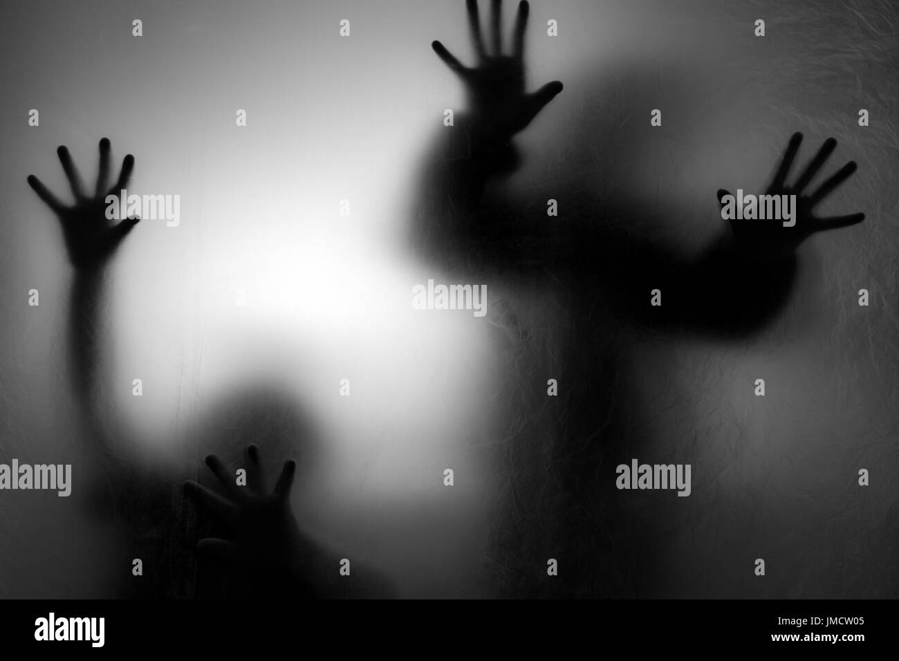 Shadowed people behind plastic silhouette Stock Photo - Alamy