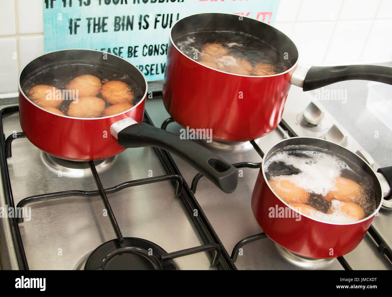 Water boiling in red pot hi-res stock photography and images - Alamy