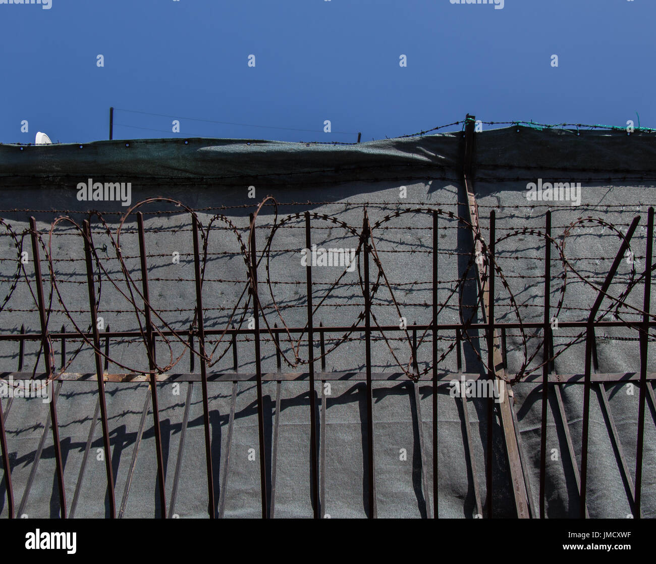 barbed wire fence used for protection purposes Stock Photo - Alamy