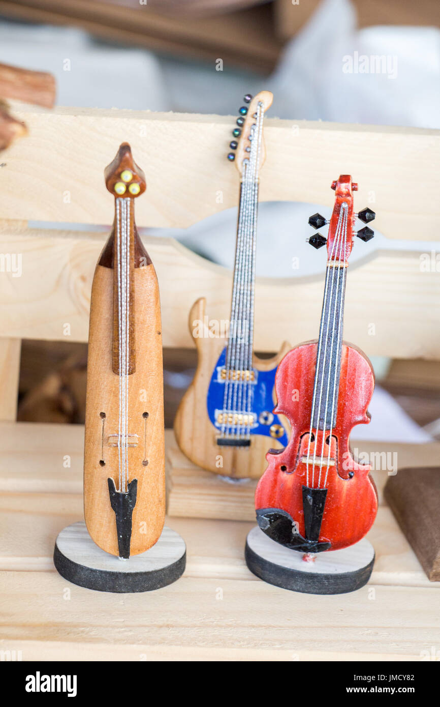 Set of models of musical instruments made of wood Stock Photo - Alamy