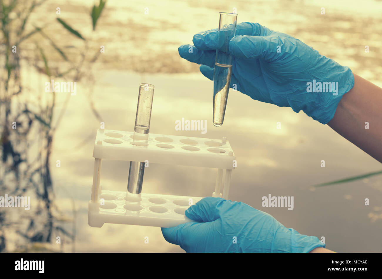 Taking a water test for analysis from a reservoir Stock Photo - Alamy