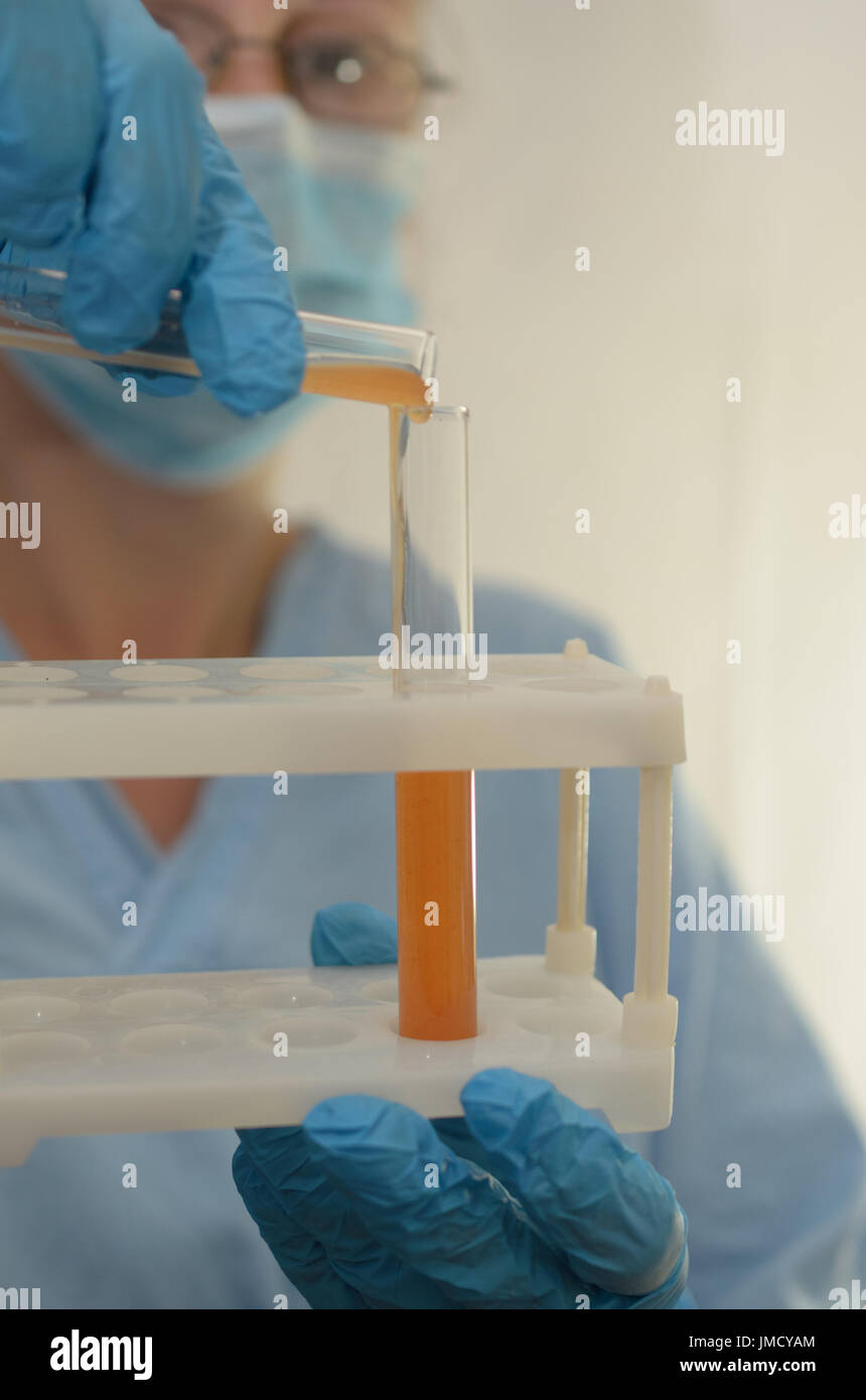 The doctor makes tests with a biological fluid Stock Photo - Alamy
