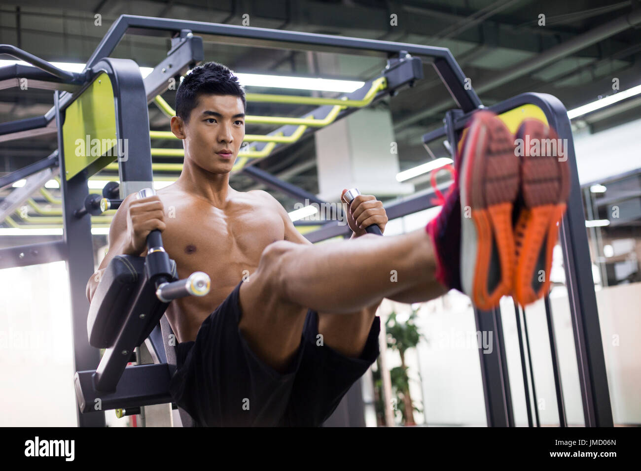 Young Chinese man exercising at gym Stock Photo - Alamy