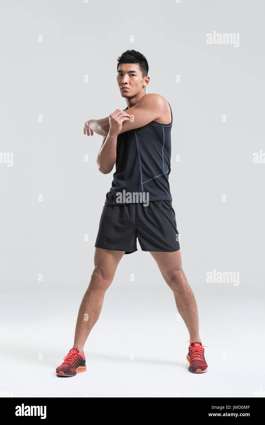 Young Chinese man exercising Stock Photo - Alamy
