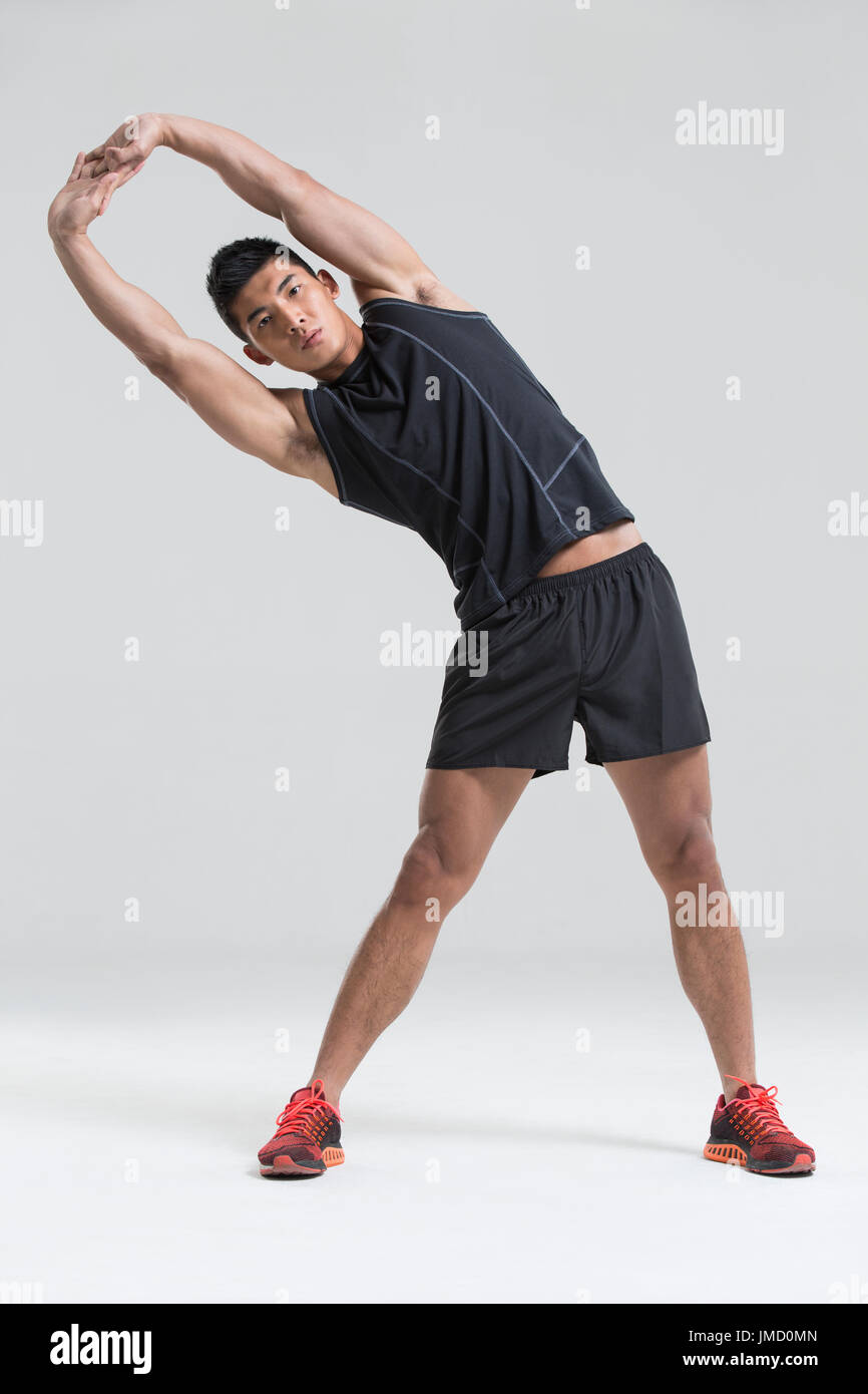 Young Chinese man exercising Stock Photo - Alamy