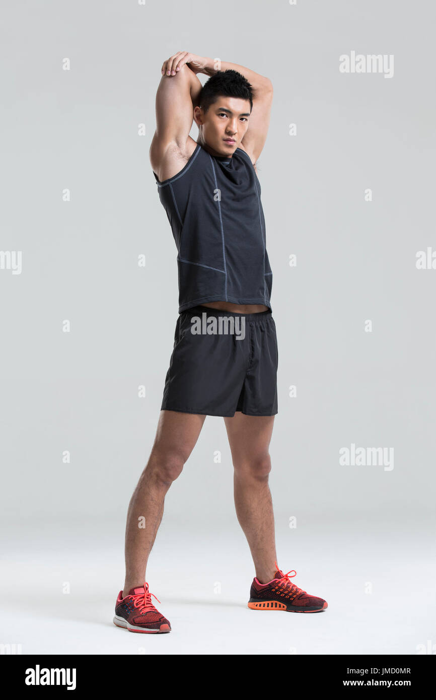 Young Chinese man exercising Stock Photo - Alamy