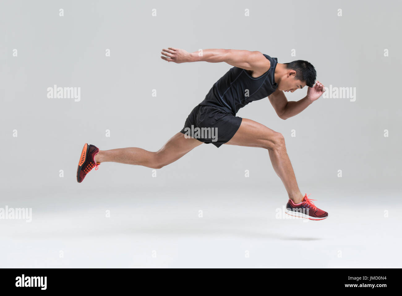 Male Chinese athlete running Stock Photo - Alamy