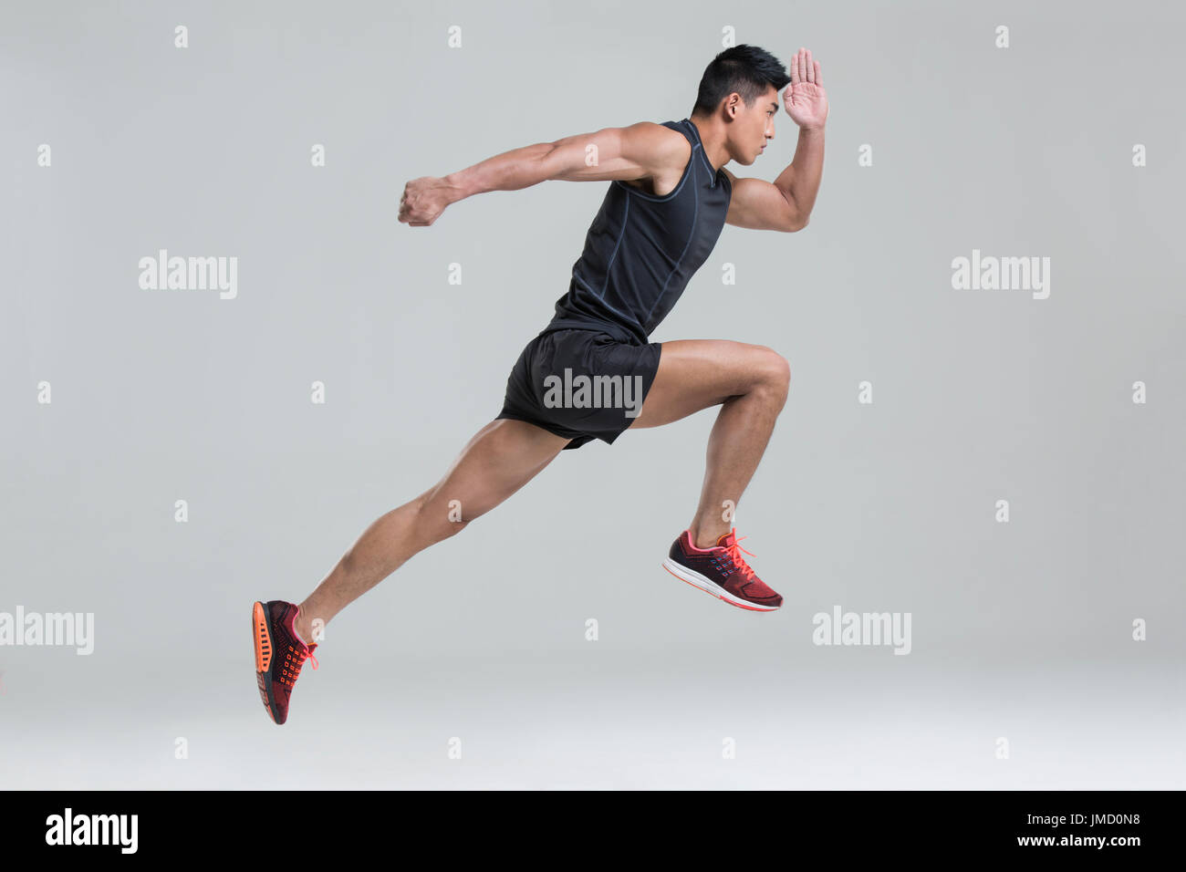 Male Chinese athlete running Stock Photo - Alamy