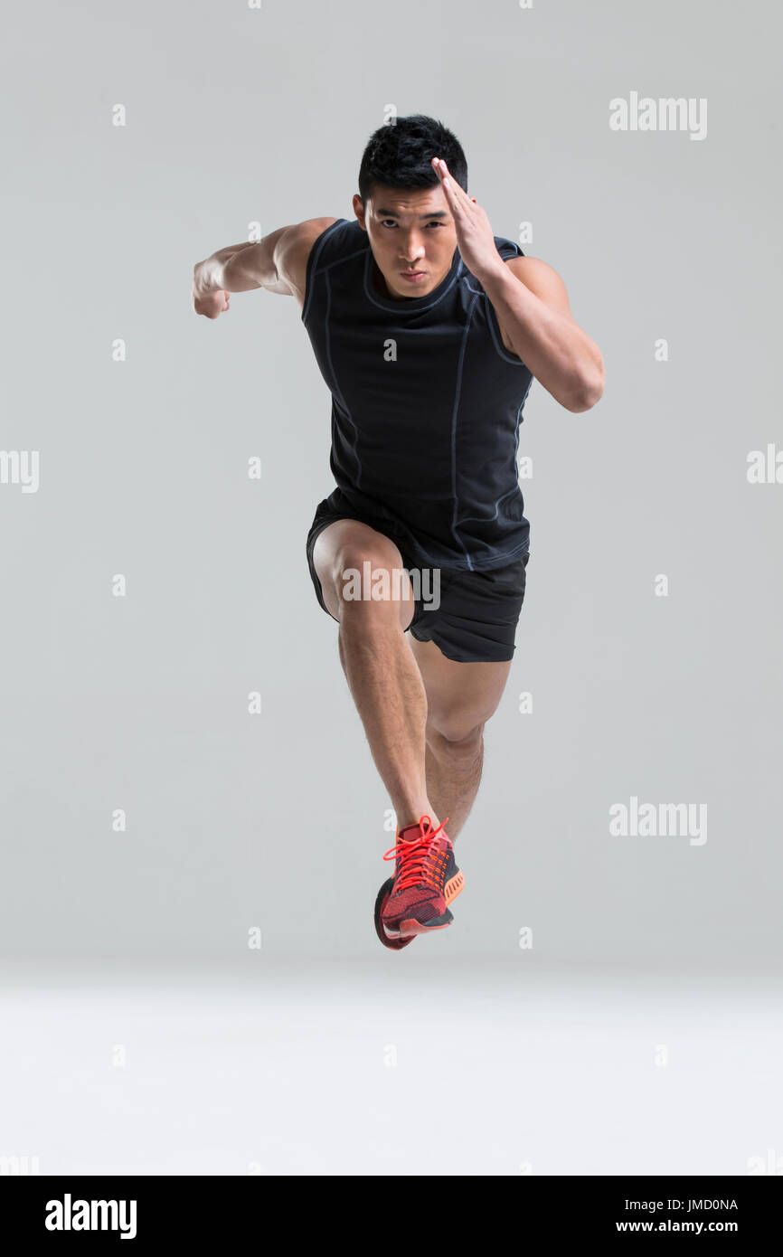 Male Chinese athlete running Stock Photo - Alamy