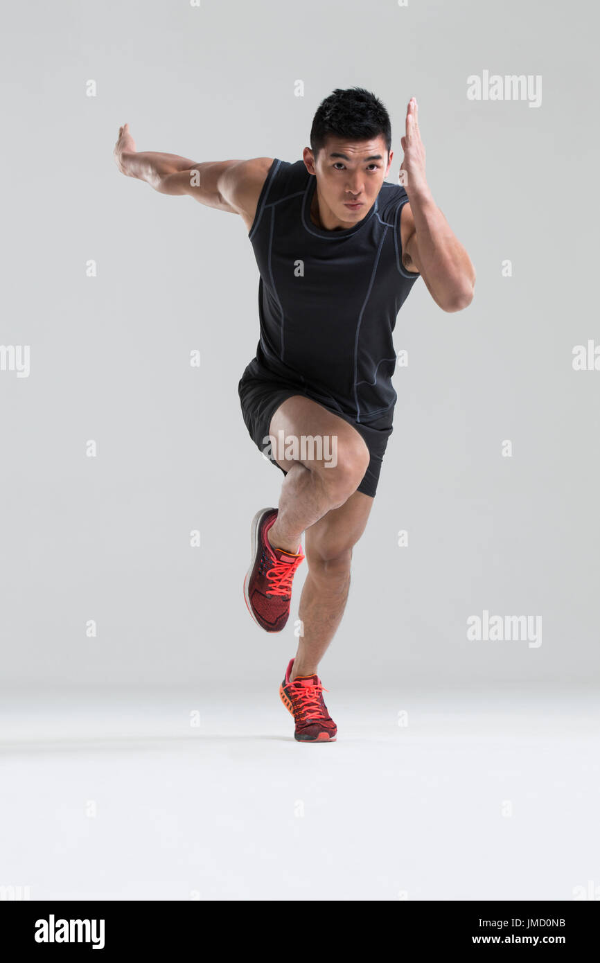 Male Chinese athlete running Stock Photo - Alamy