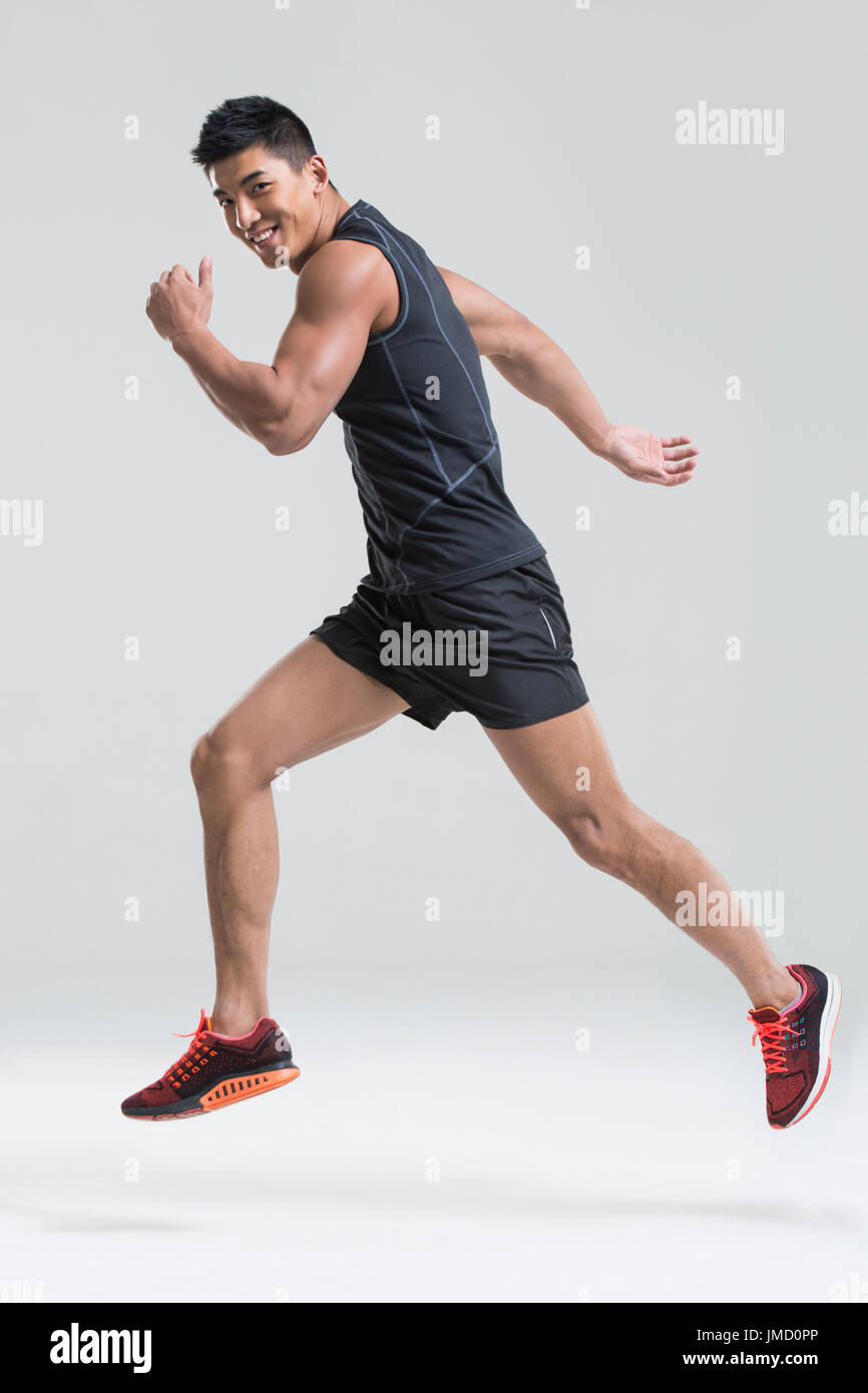 Male Chinese athlete running Stock Photo - Alamy