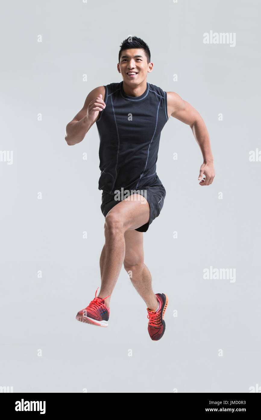Male Chinese athlete running Stock Photo - Alamy
