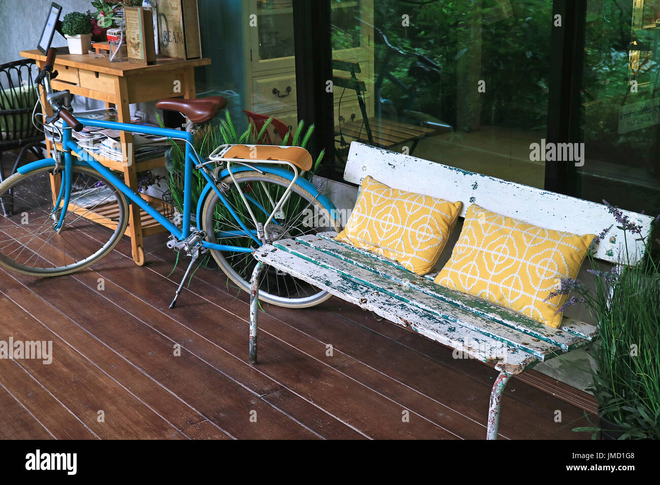 Relaxing space at the terrace with cozy bench and bicycle Stock Photo ...