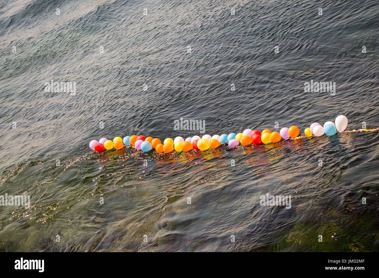 Balloons in shooting range as targets on water Stock Photo - Alamy