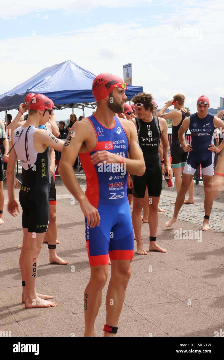 Adam Bowden Team GB elite triathlete stretching before the swimming leg ...