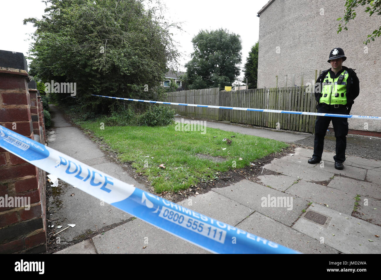 Police At The Scene Where Armed Officers Have Shot A Man And Another