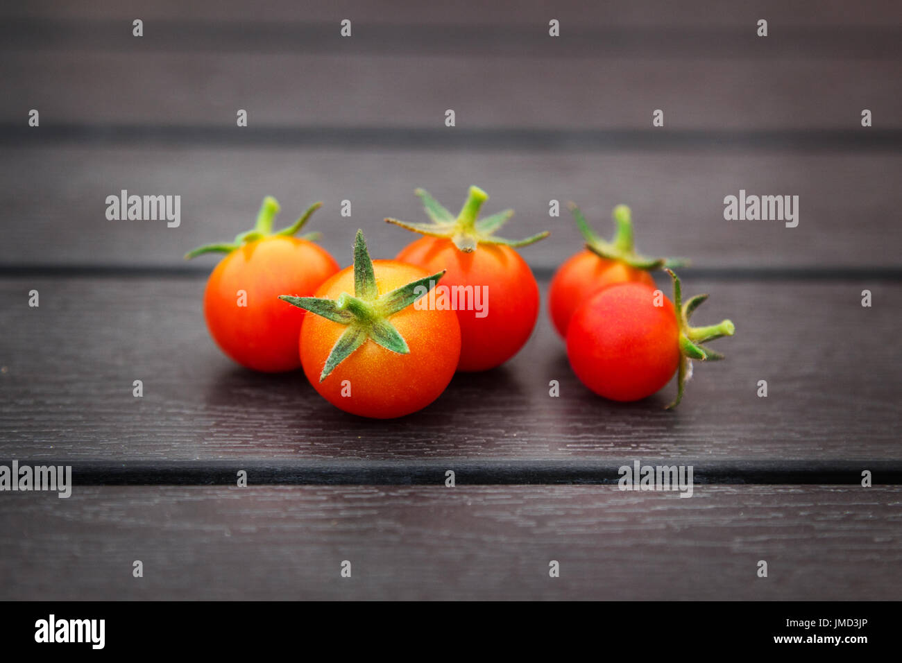 Five Tomatoes Cherry On A Wooden Table, Summer Harvest Stock Photo - Alamy