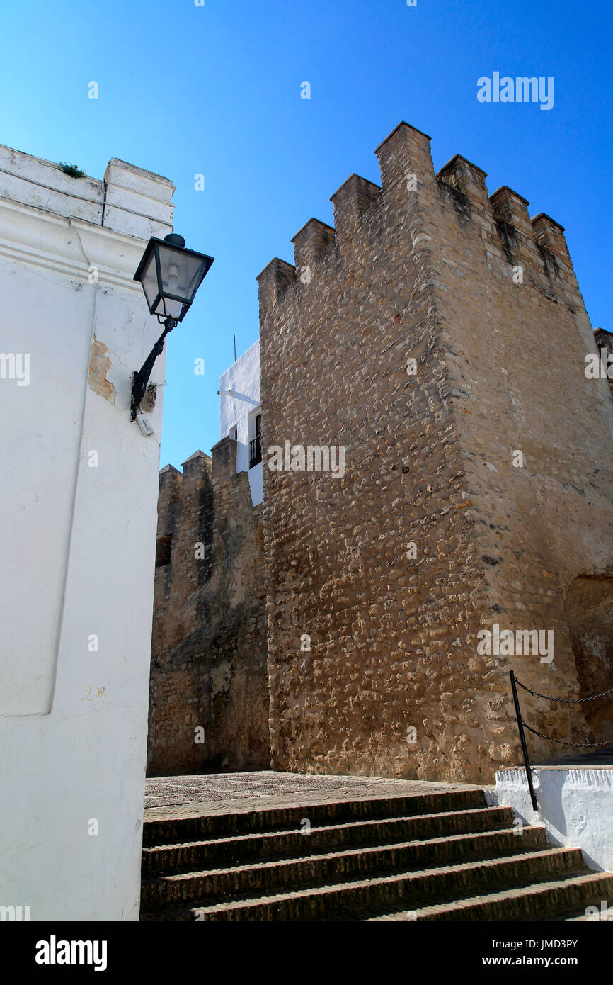 Historic street and castle walls in the village of Vejer de la Frontera ...