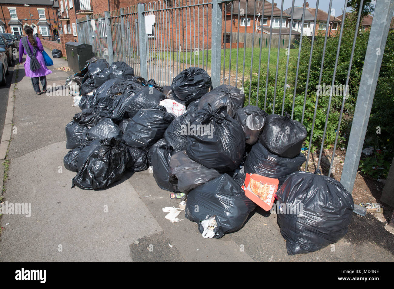 Piles of uncollected rubbish in Tarry Road, Alum Rock, Birmingham. The ...