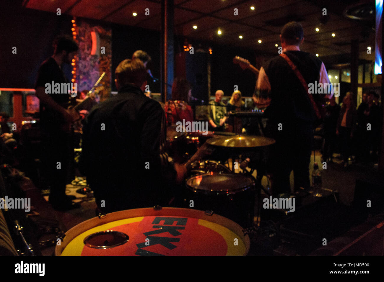 Band behind drum kit music industry Stock Photo - Alamy