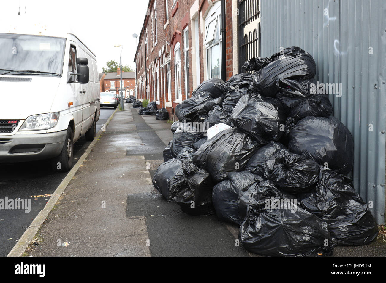 Rubbish bags piled high in Tarry Road, Birmingham as the ongoing ...