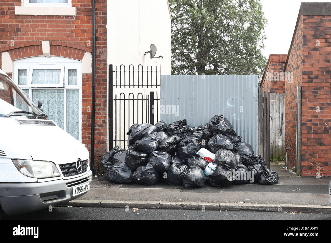 Rubbish bags piled high in Tarry Road, Birmingham as the ongoing ...