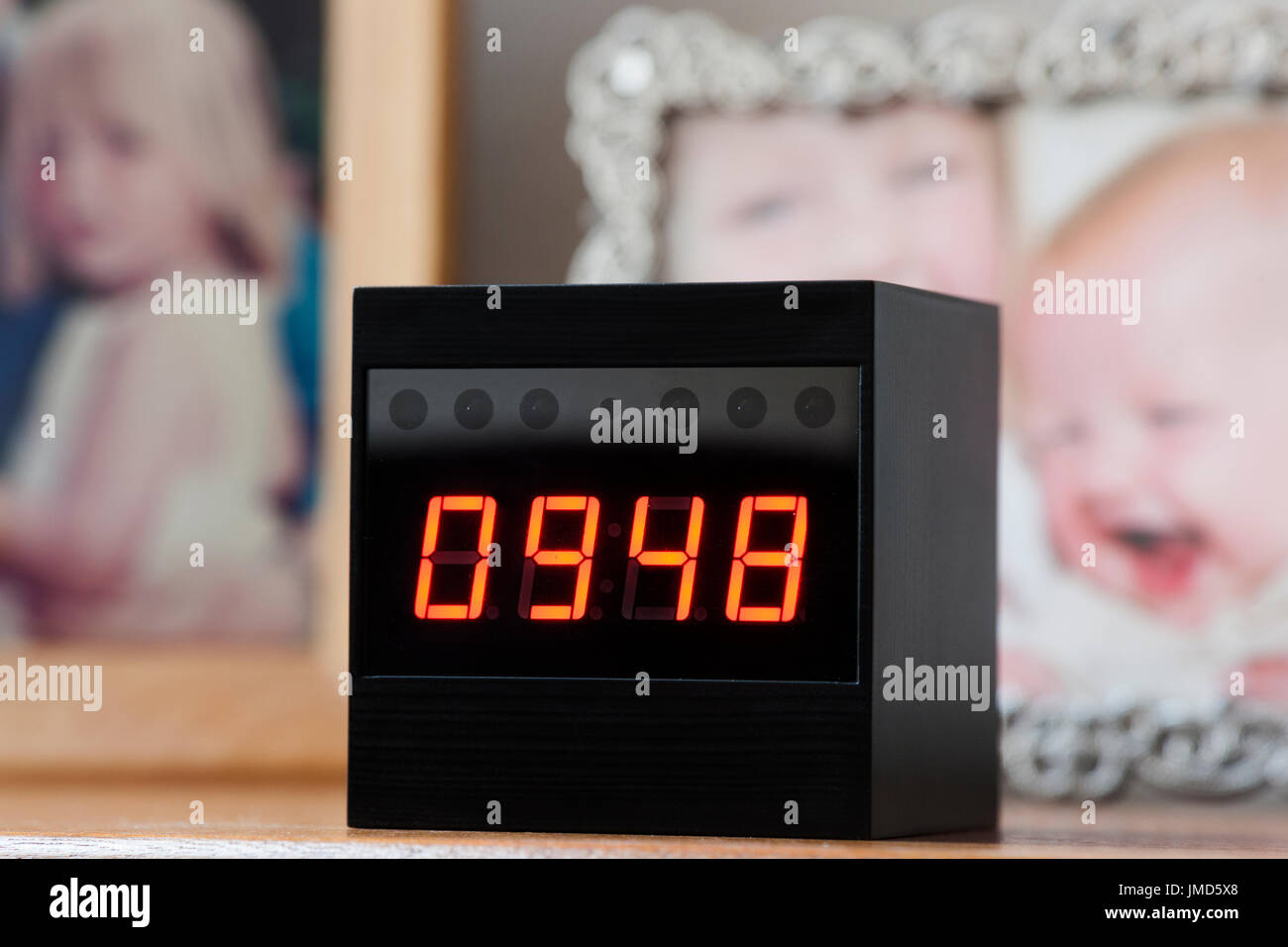 Secret spy camera hidden in a digital clock of the sort used to monitor ...