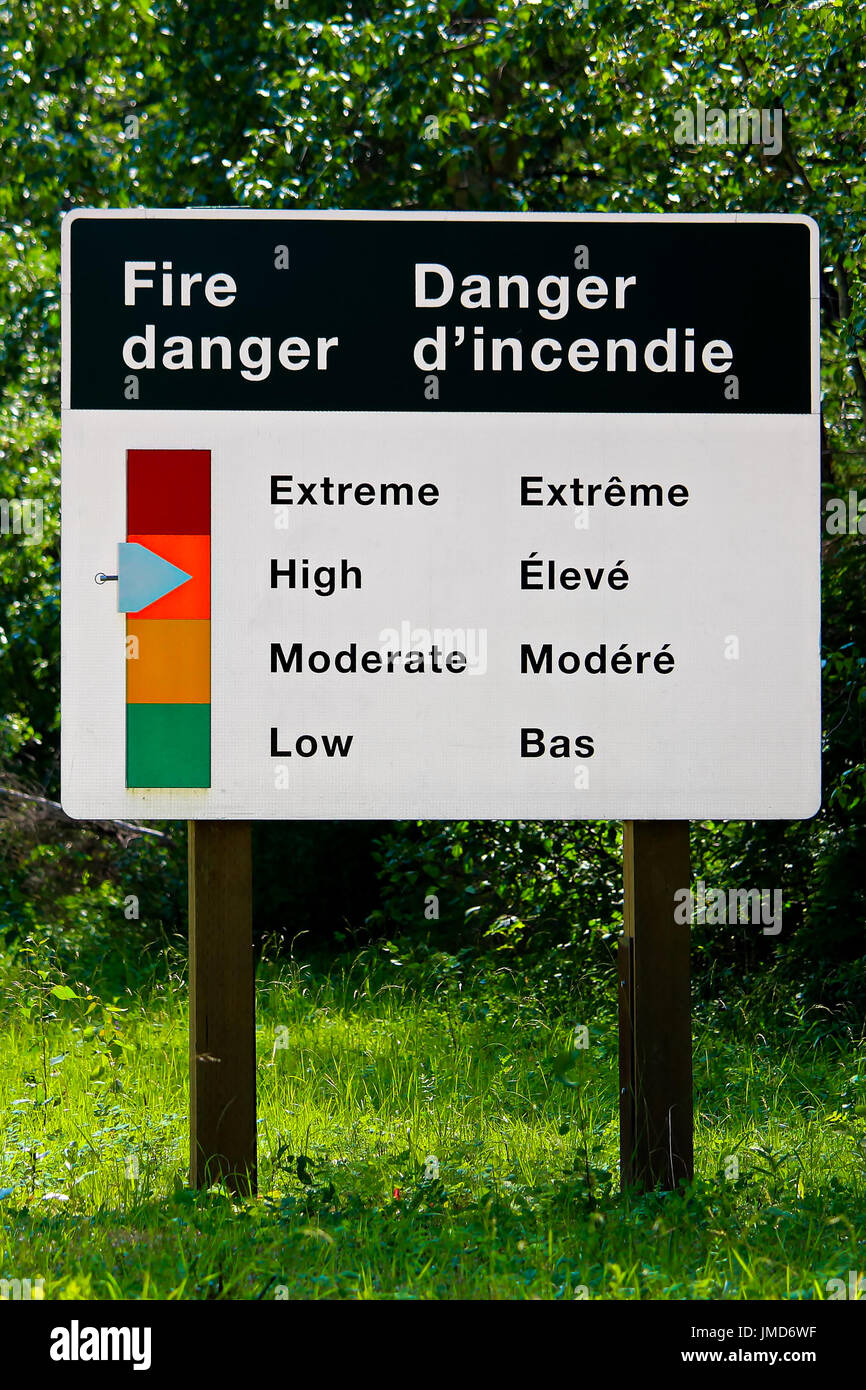 A fire danger indicator sign in both english and french Stock Photo - Alamy