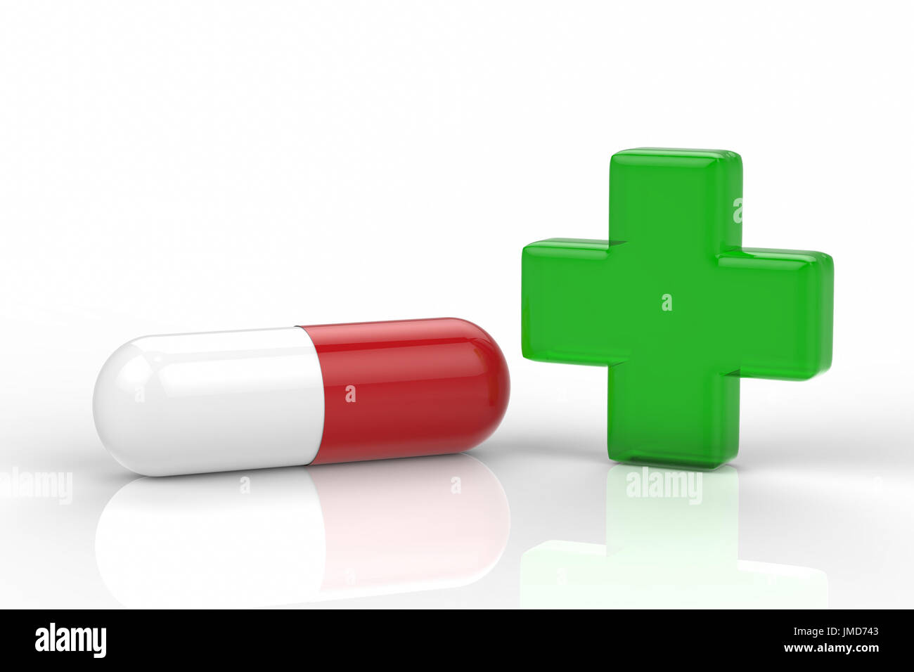 green cross and capsule pill on white background Stock Photo - Alamy