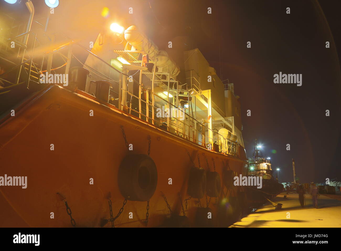 big red ship on the seashore side Stock Photo - Alamy