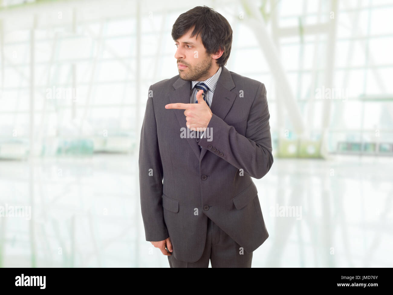 young business man pointing, at the office Stock Photo - Alamy