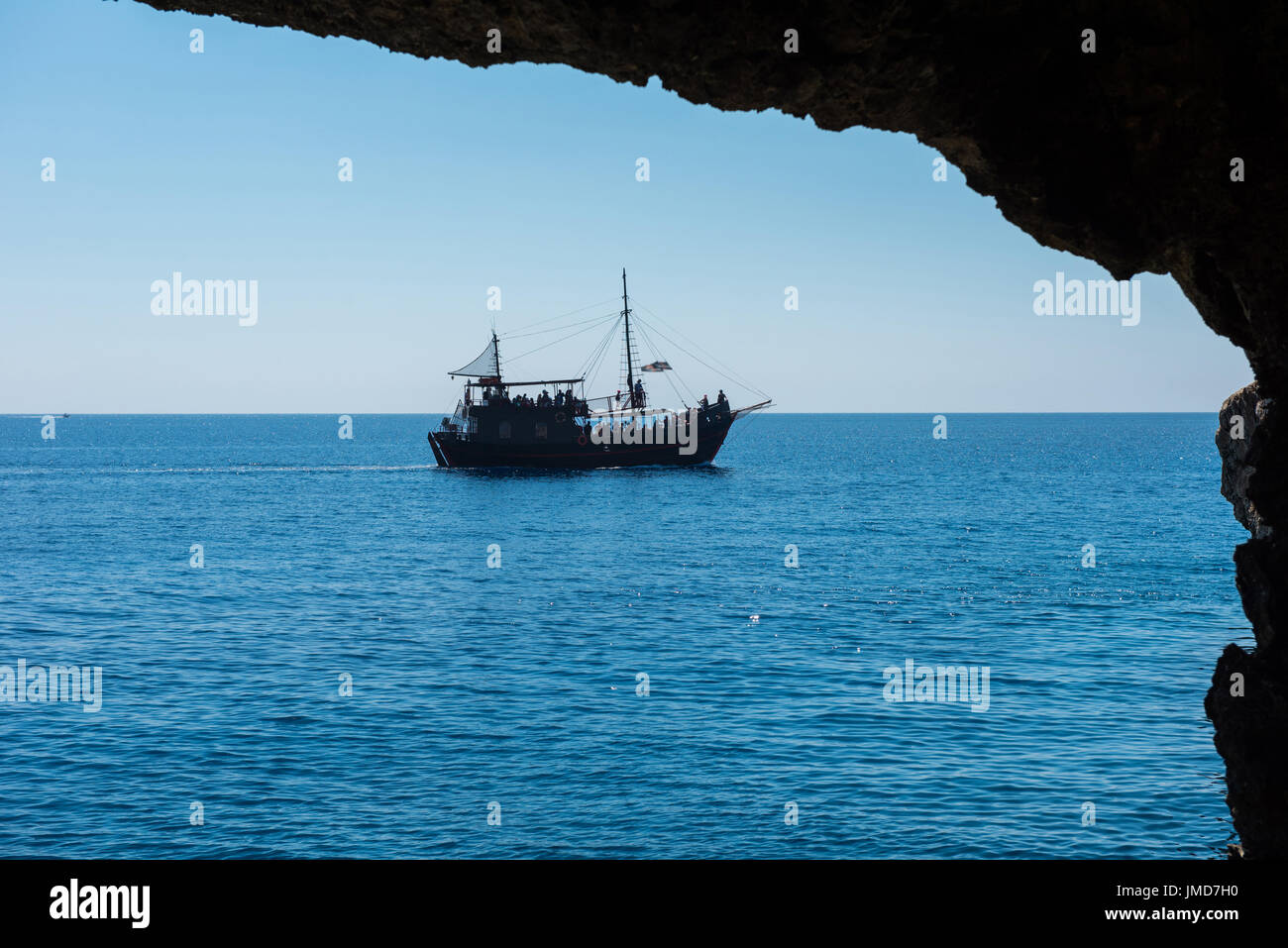 Pirate ship sailing in the sea. View from inside a cave Stock Photo - Alamy