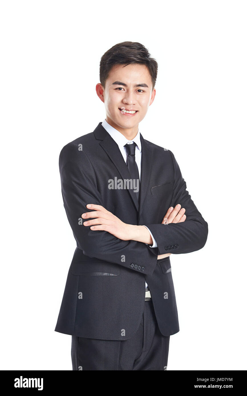 studio portrait of a young asian businessman in formal wear, arms ...